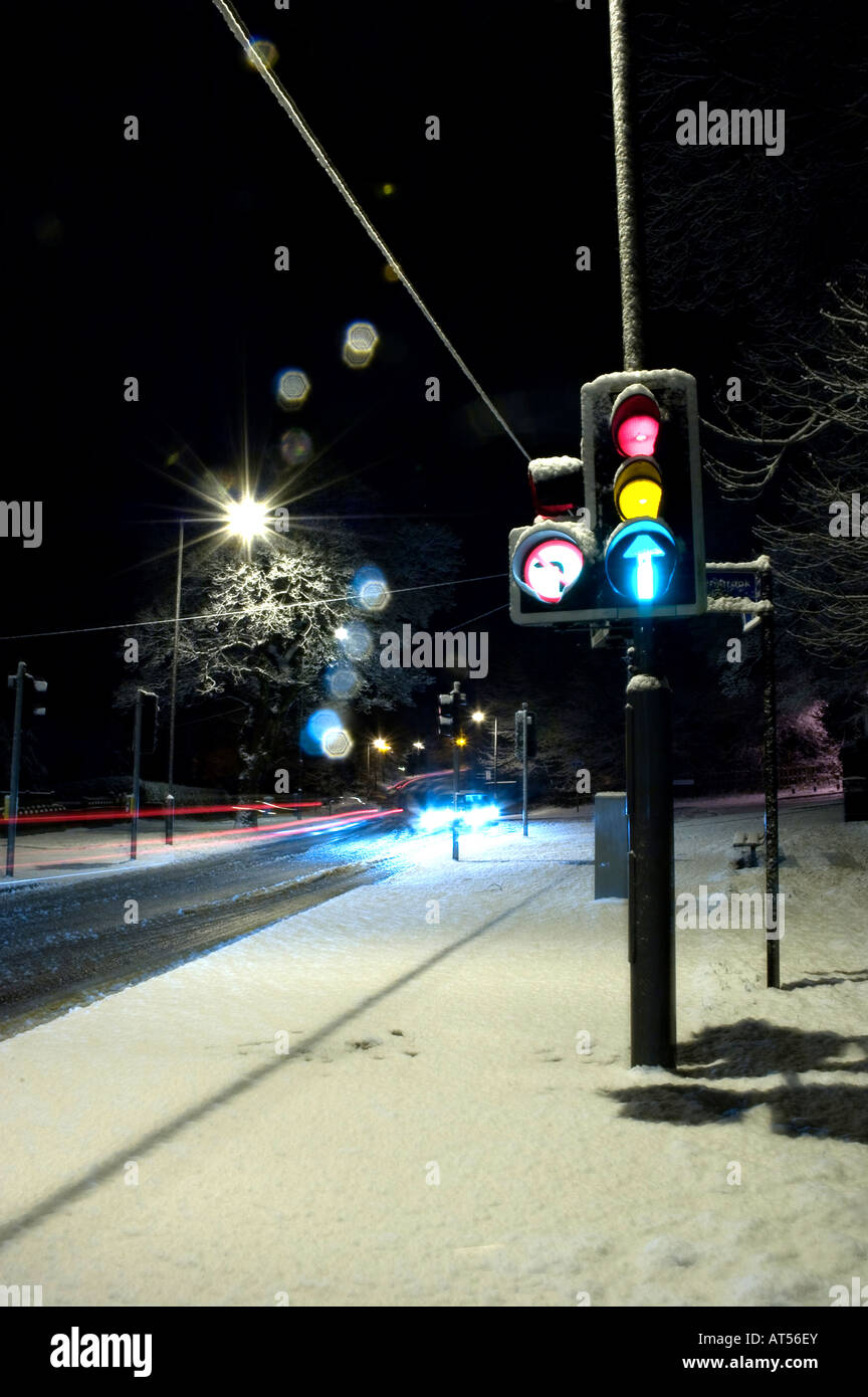 Snowy road junction with traffic light Stock Photo - Alamy