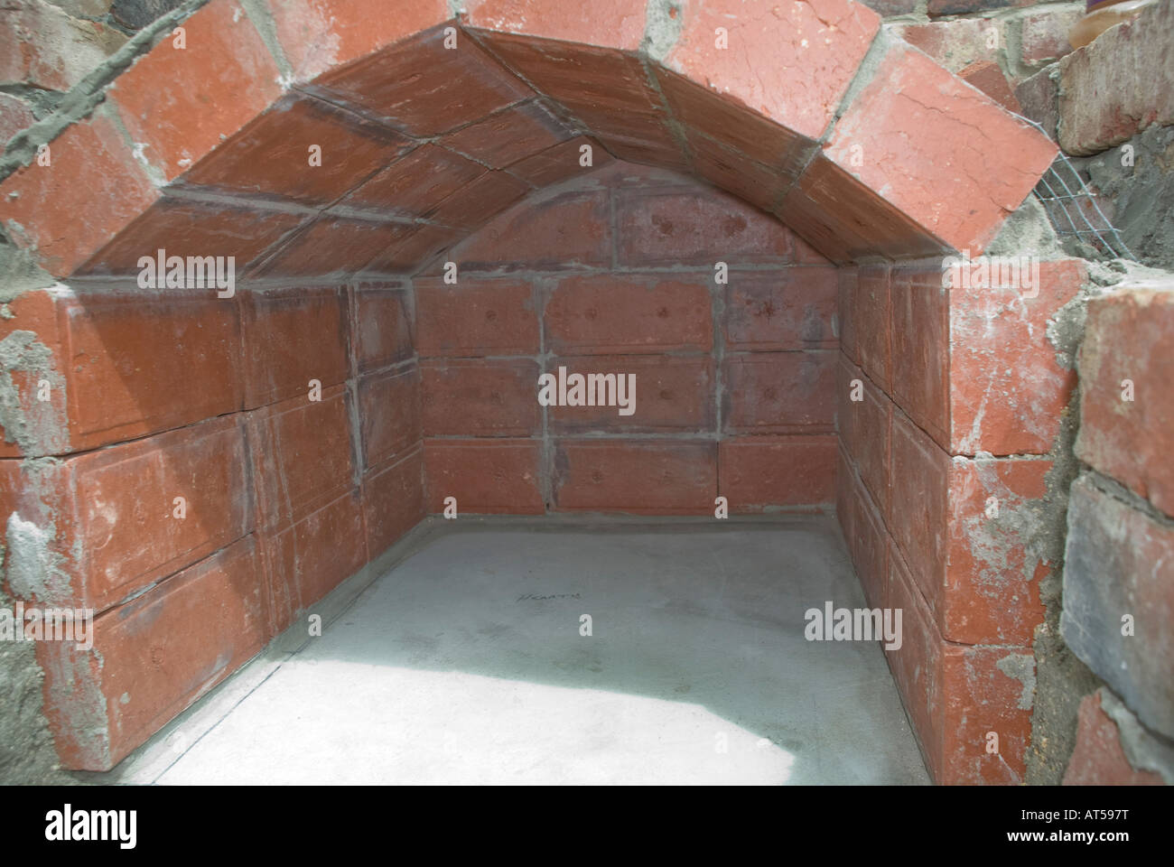 Detail of the fire vault in building an outdoor wood fired oven Stock ...