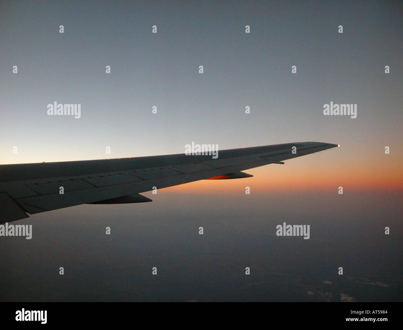 Wing at sunset Stock Photo - Alamy