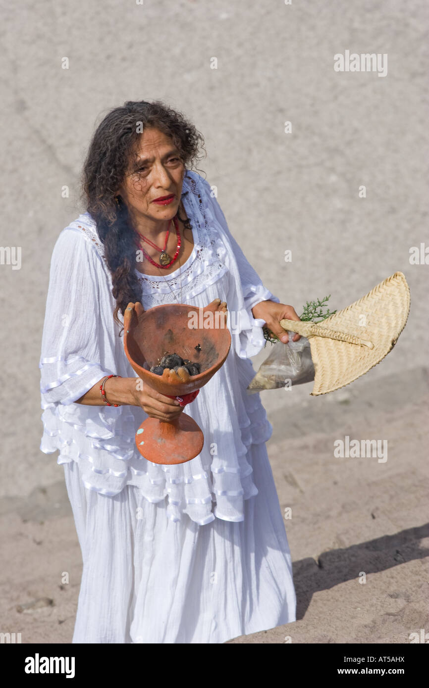 Religious woman doing a ritual in the Quetzalcoatl temple at ...