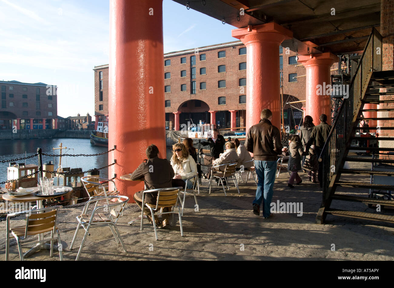 people sitting eating drinking outdoor cafe bar in the restored and ...