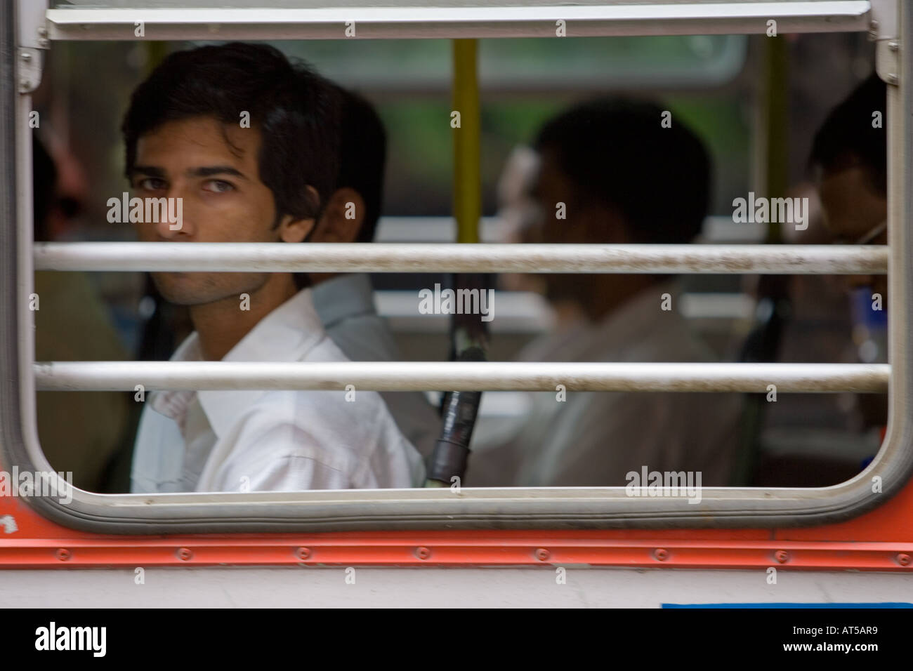 Man looking out of window on a bus, Mumbai - India Stock Photo - Alamy