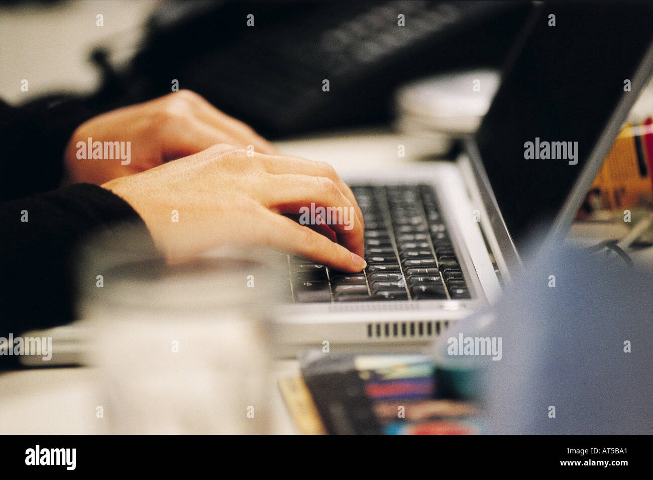 hands on laptop keyboard Stock Photo - Alamy