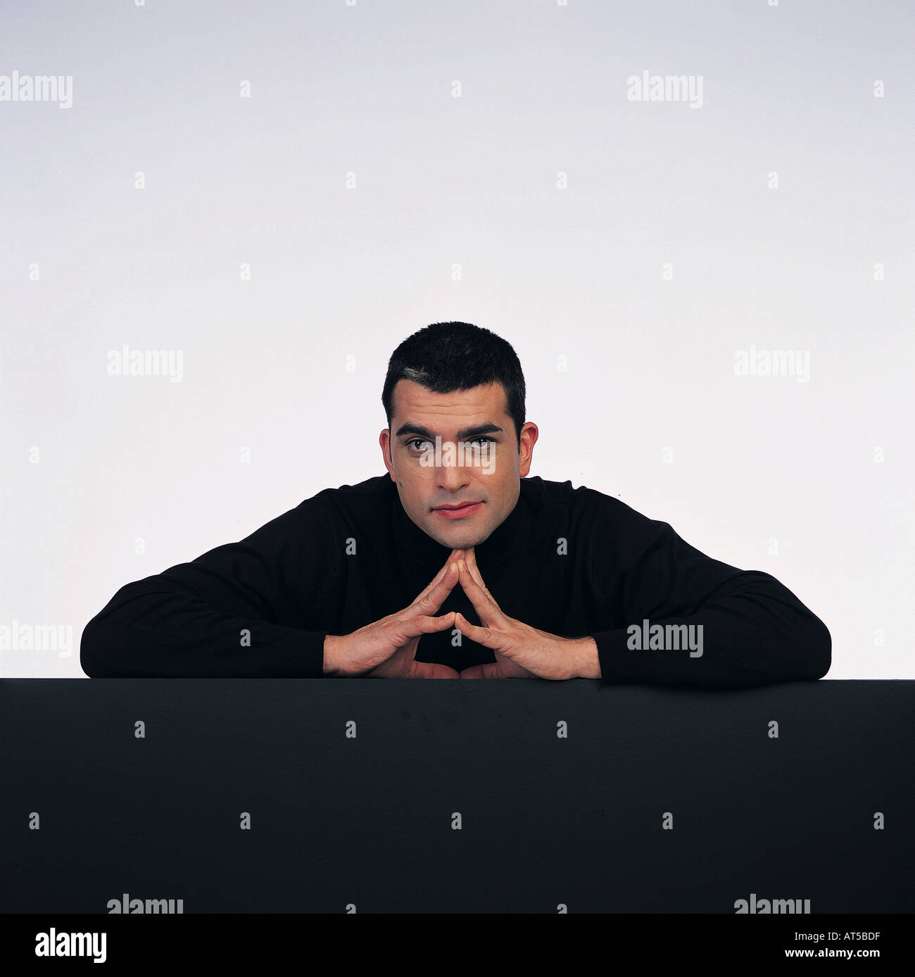 man looking over wall Stock Photo - Alamy