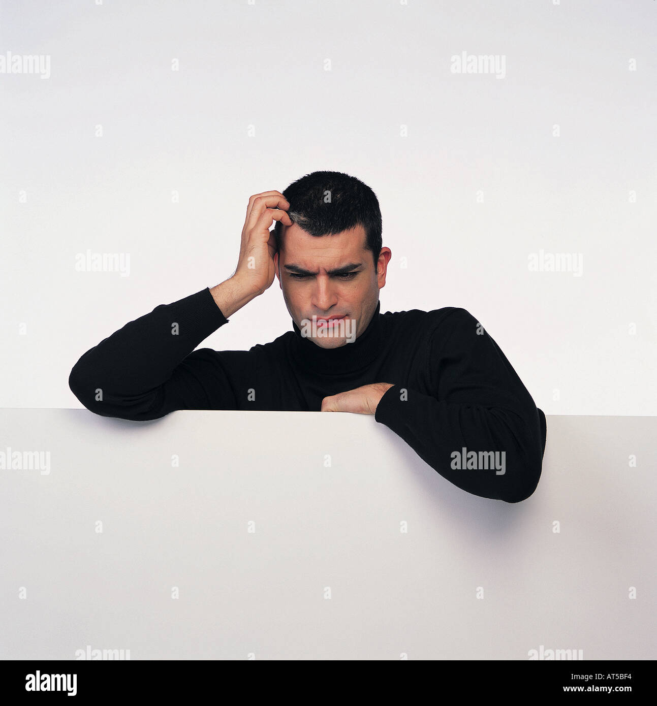 man resting on top of wall Stock Photo - Alamy