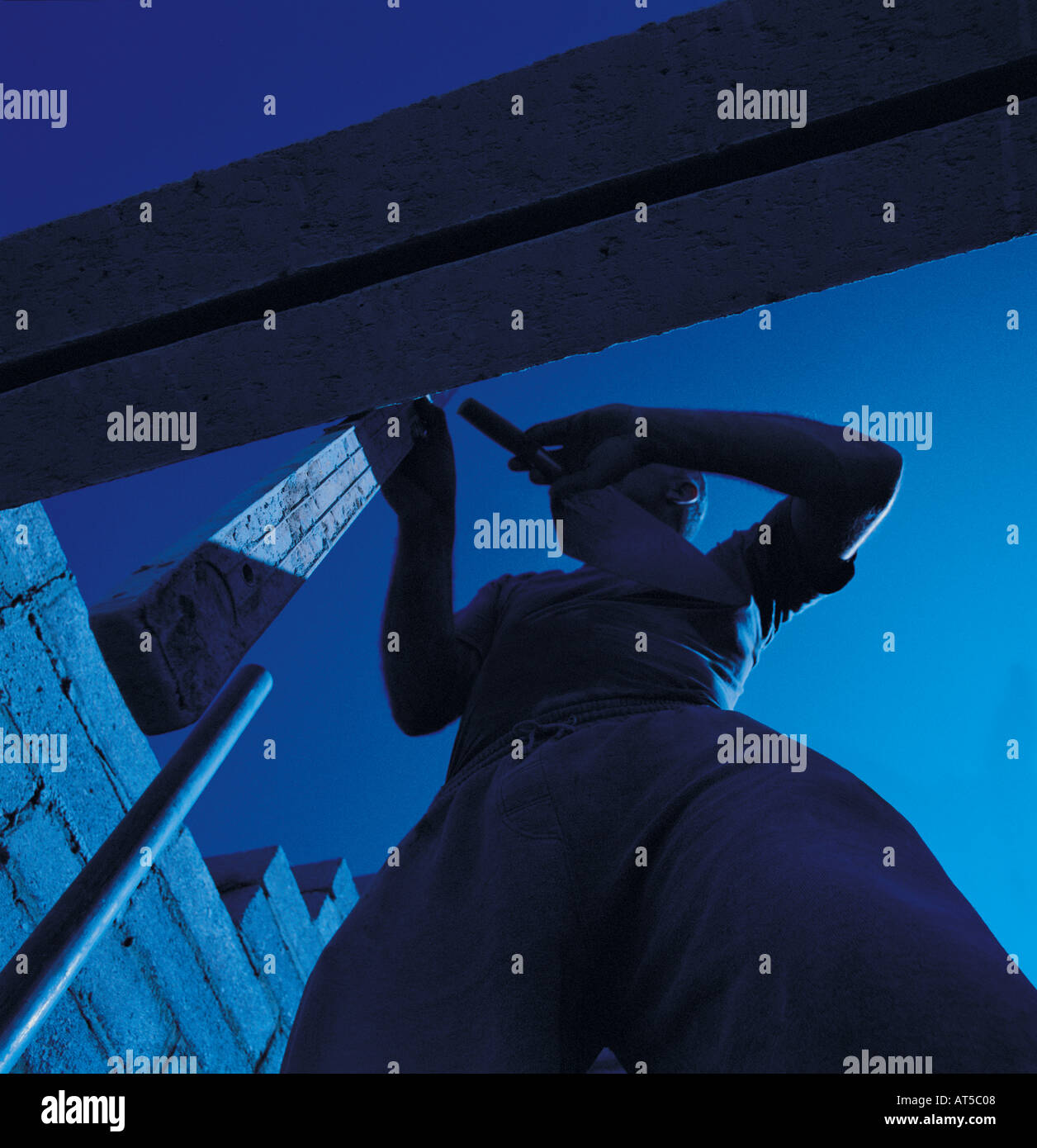 construction worker checking level of wall Stock Photo - Alamy