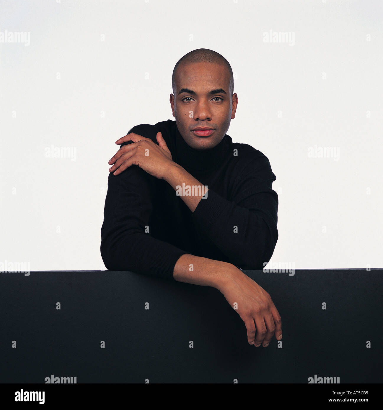 man looking over wall Stock Photo - Alamy