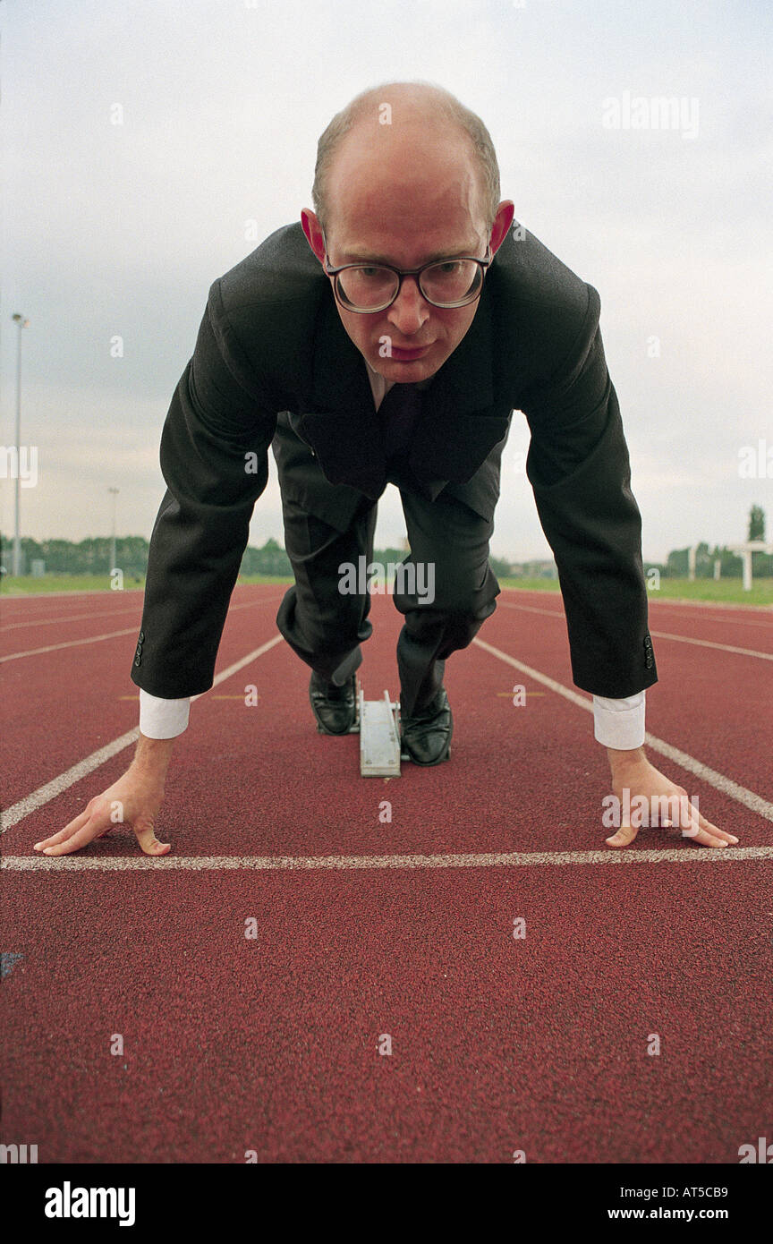 man on starting blocks of running track Stock Photo - Alamy