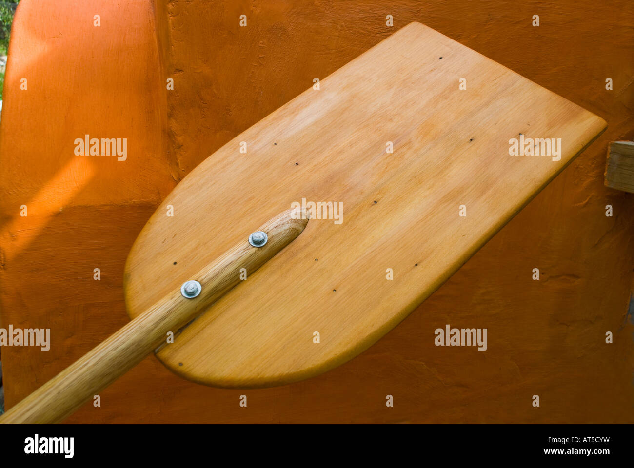 An outdoor oven implement called a peel used for placing food into a ...