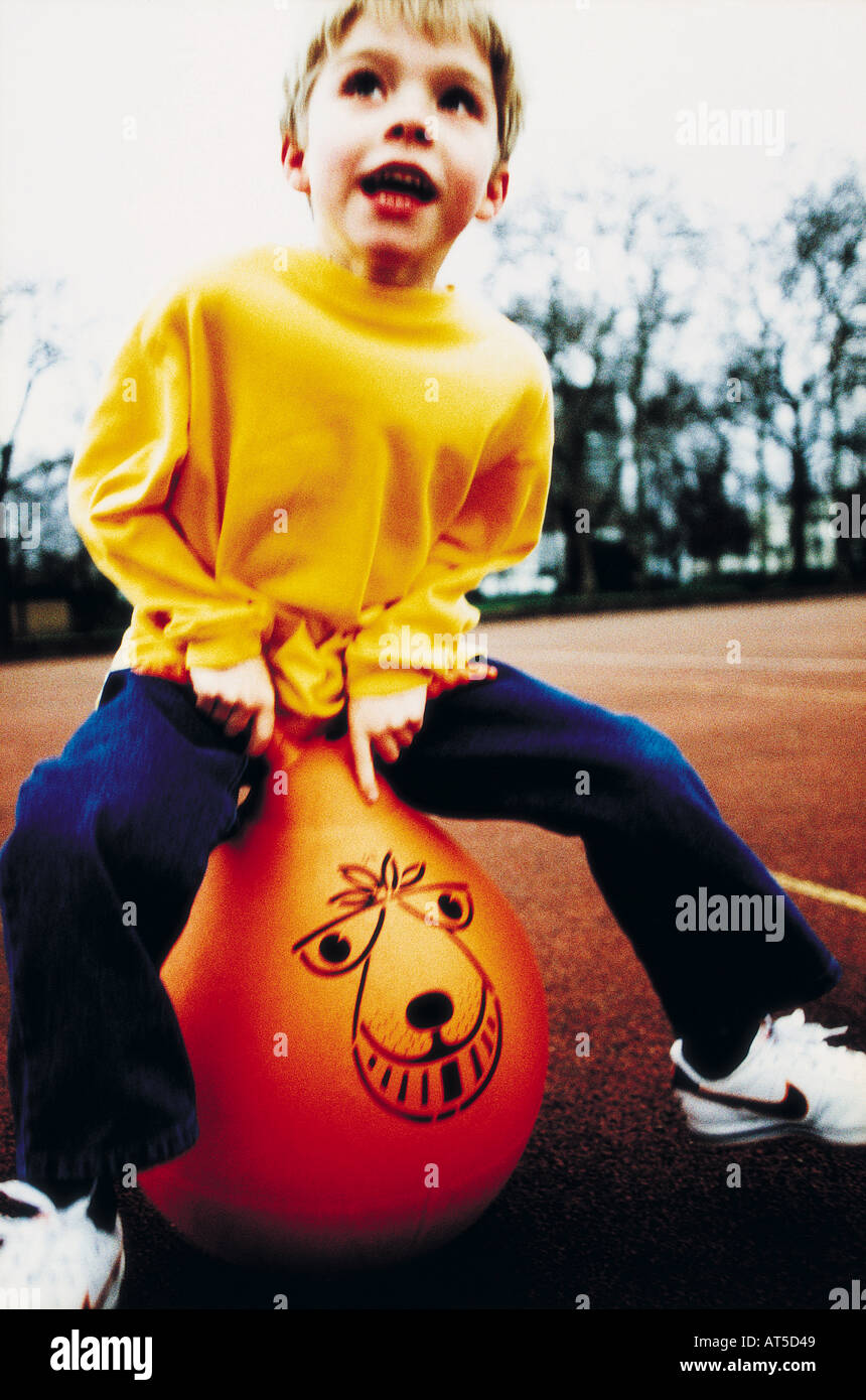child playing on spacehopper Stock Photo - Alamy