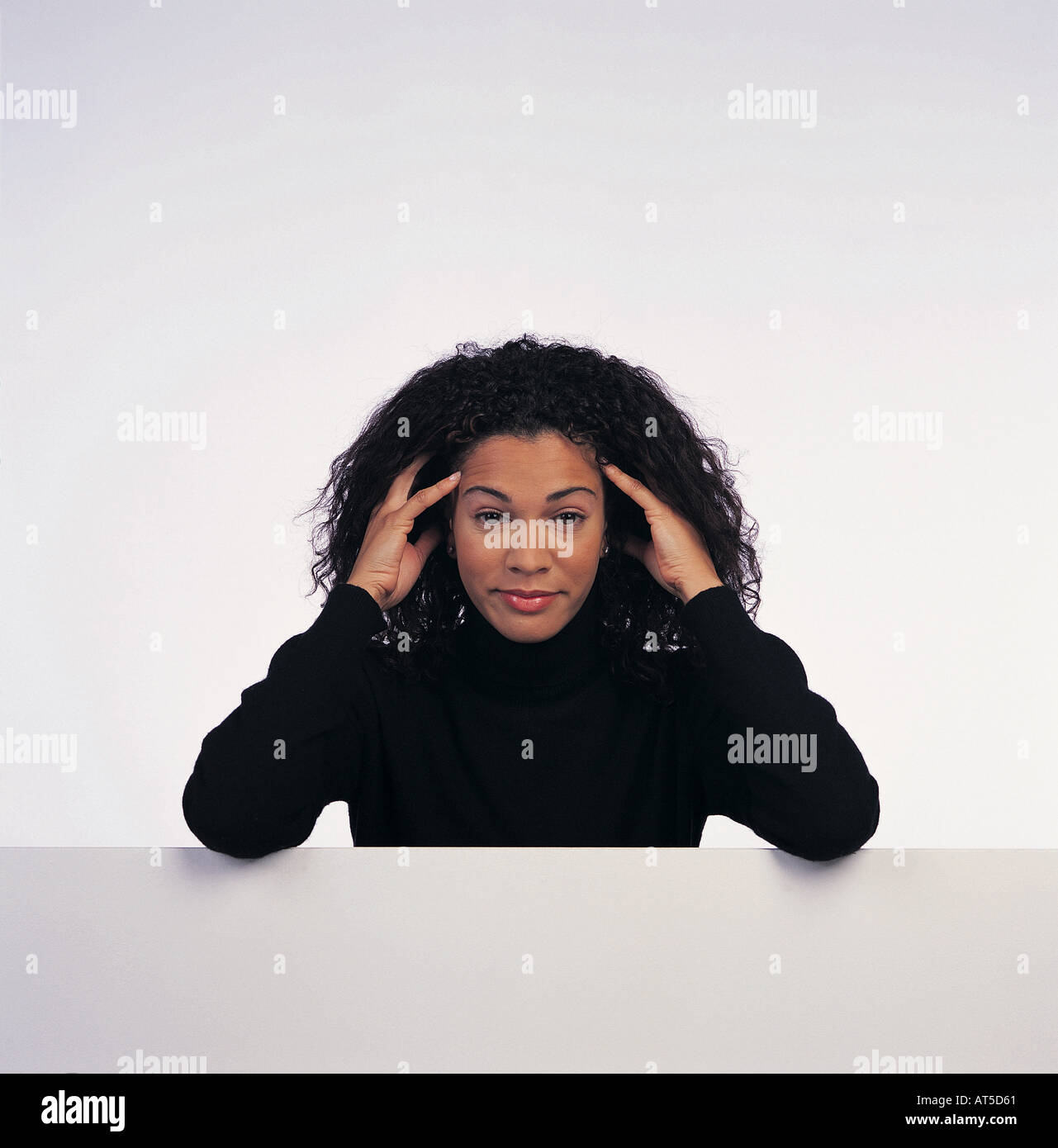 woman looking over wall Stock Photo - Alamy