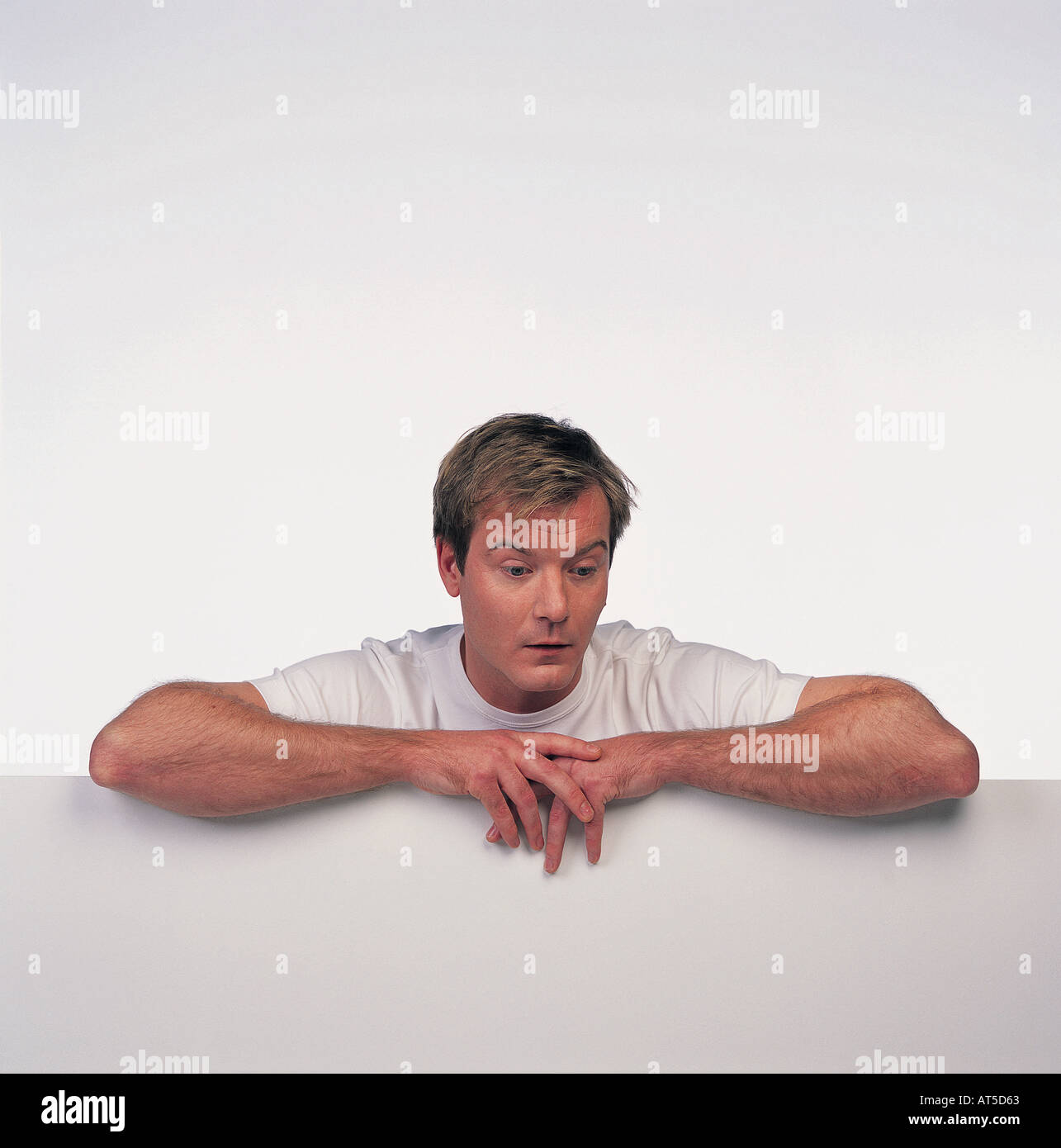 man looking over wall Stock Photo - Alamy