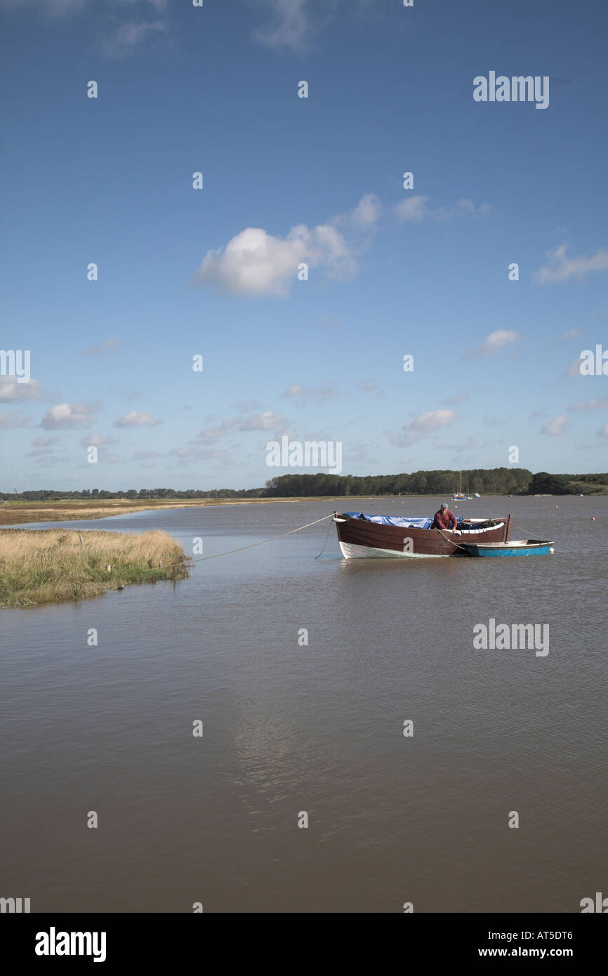 Man fixing his boat, Butley Creek, Suffolk, England Stock Photo - Alamy