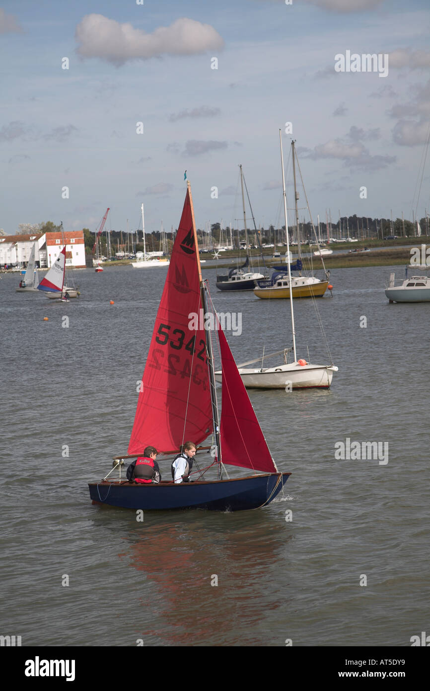 Mirror sailing boat with red sail River Deben Woodbridge Suffolk ...