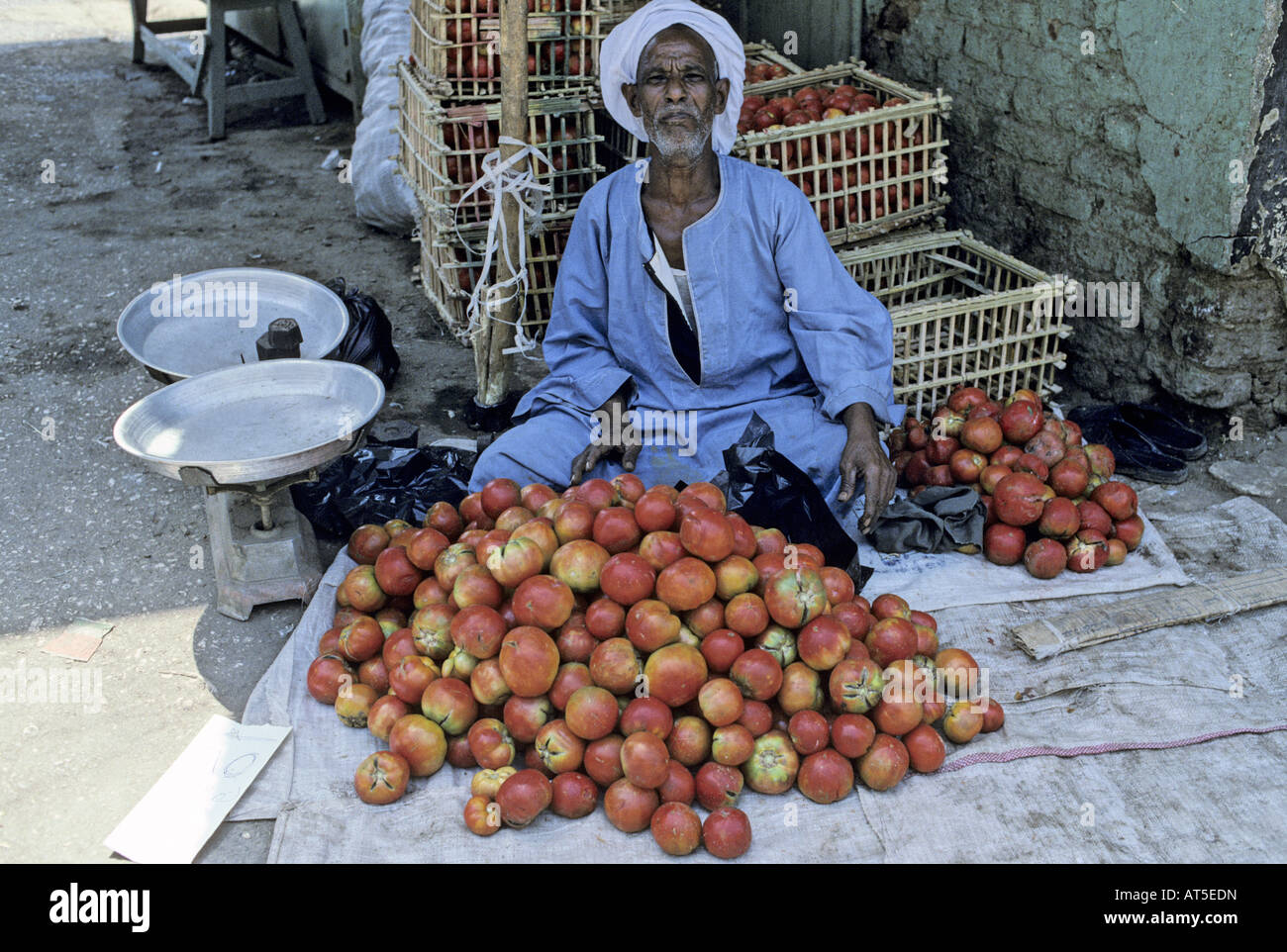 Egyptian man selling fruit in the street near the market in Luxor Egypt ...