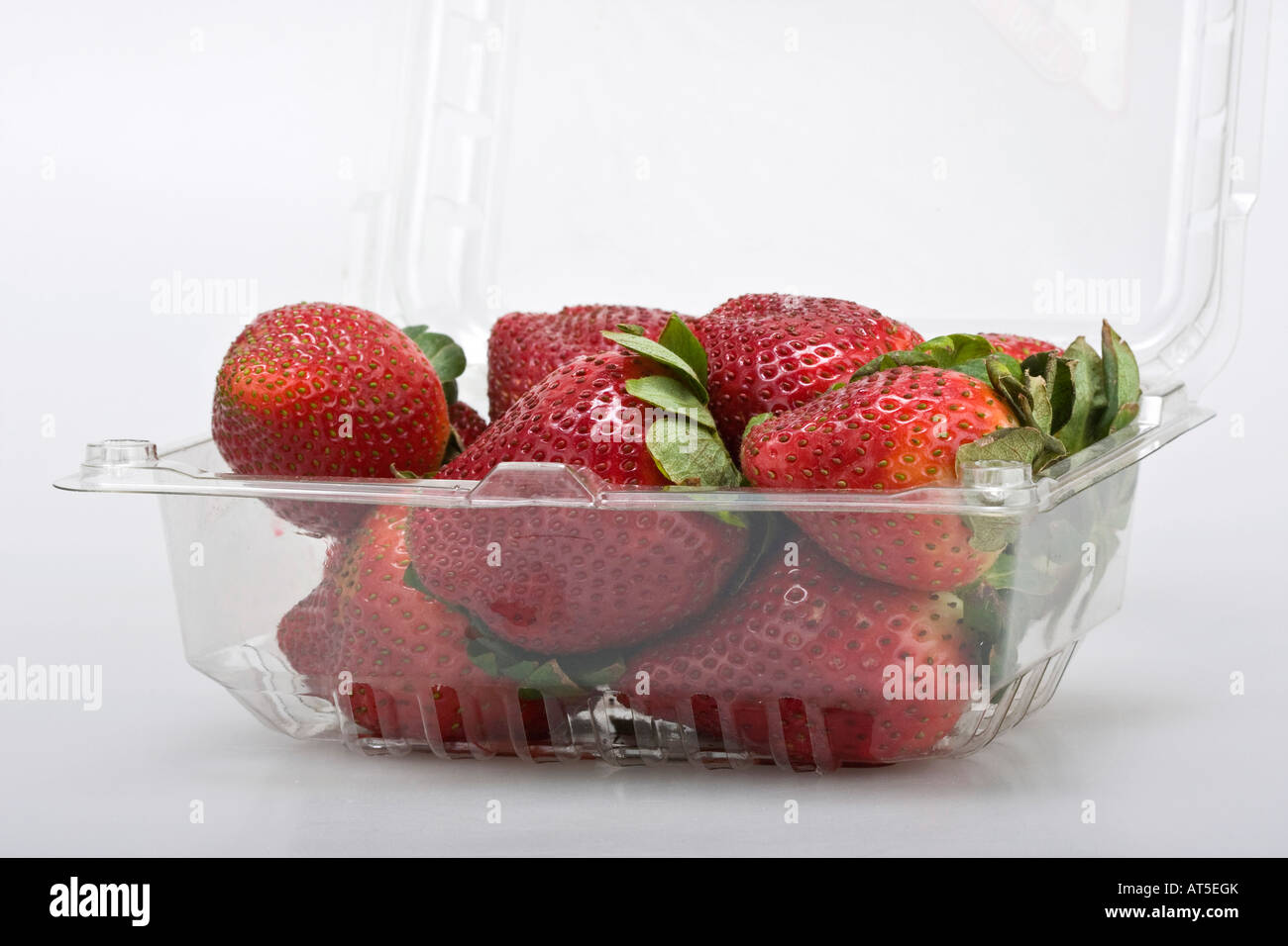 Strawberries fruit in plastic container selling at farmers market from ...