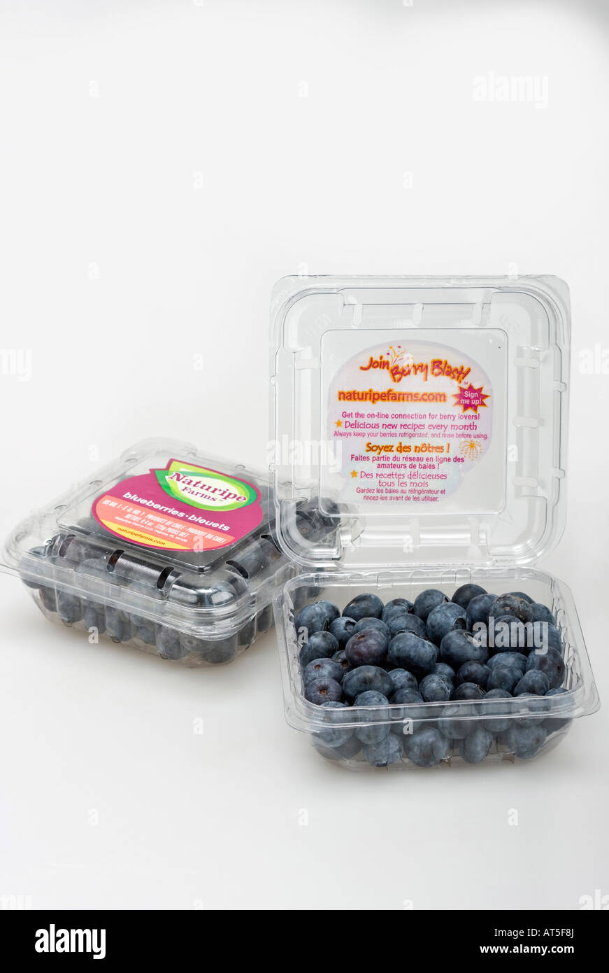 Blueberries fruit in plastic container selling at farmers market ...