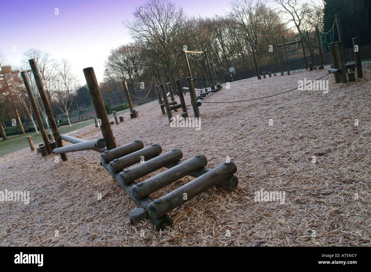Bark chipping safety surface in children's playground Stock Photo - Alamy