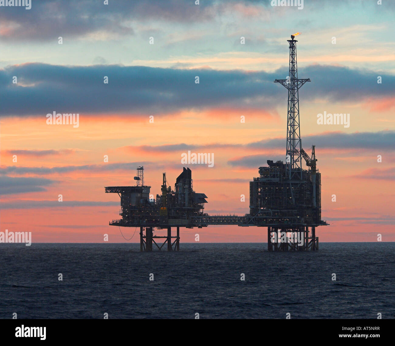 Rig at sunset Stock Photo - Alamy