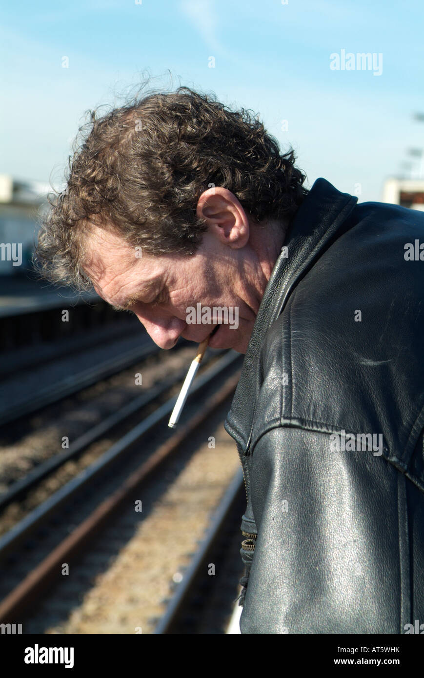 Man cigarette train station hi-res stock photography and images - Alamy