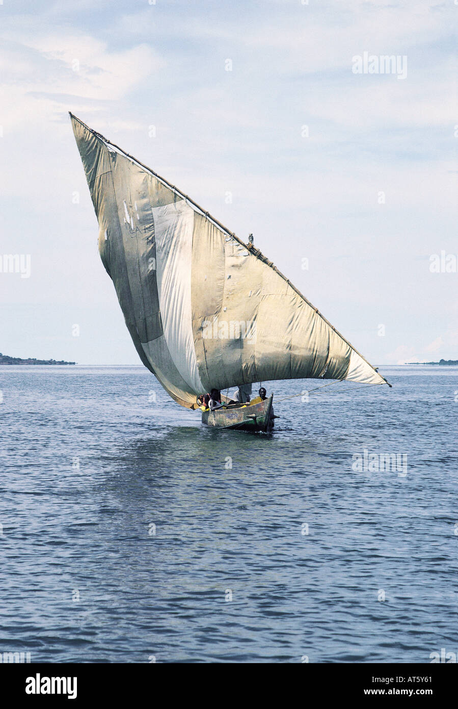 A traditional Luo sailing canoe with Jaluo fishermen on board near ...