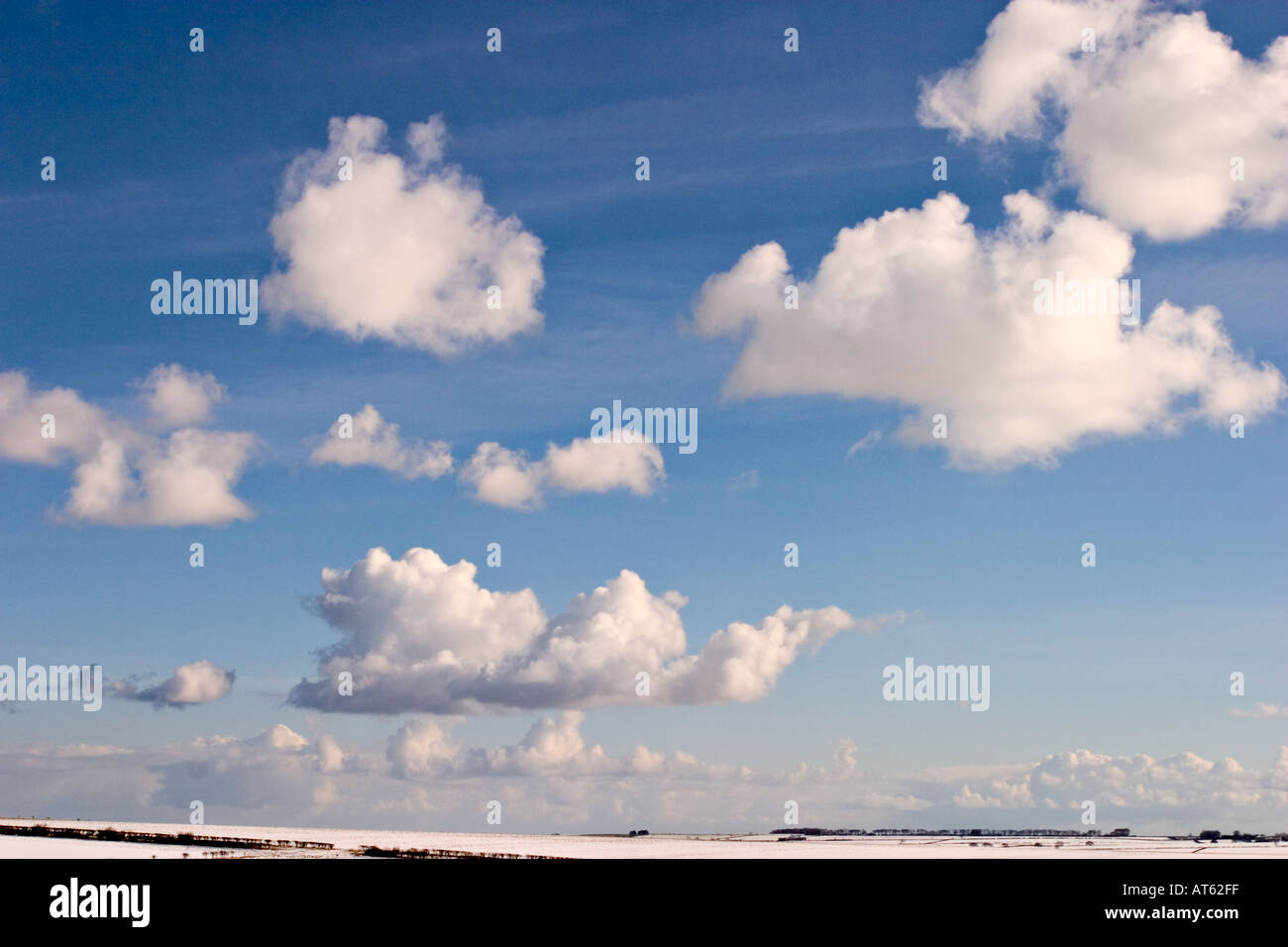 Winter Cumulus clouds above snowy Yorkshire Wolds UK Stock Photo - Alamy