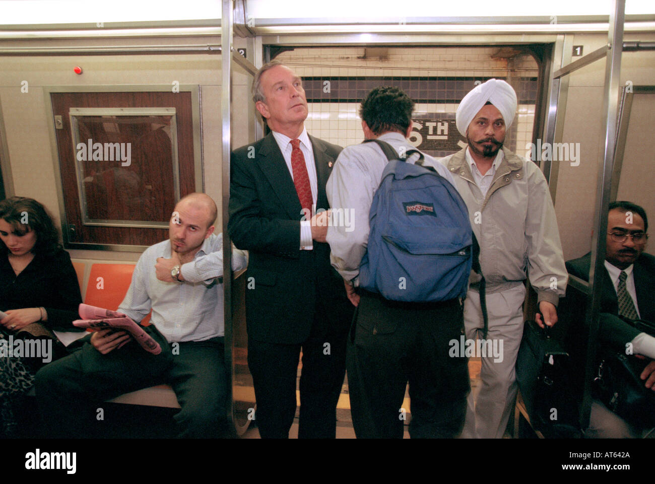 Billionaire NYC Mayor Michael Bloomberg standing L rides the R train on ...