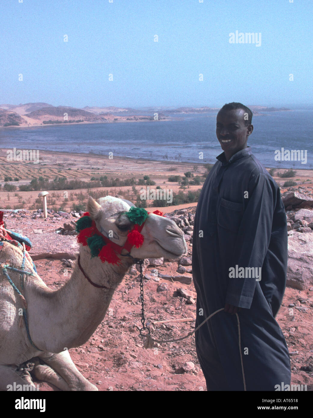 Camel and camel guide. New Sebua, Upper Egypt, Egypt. Ann rides a camel ...