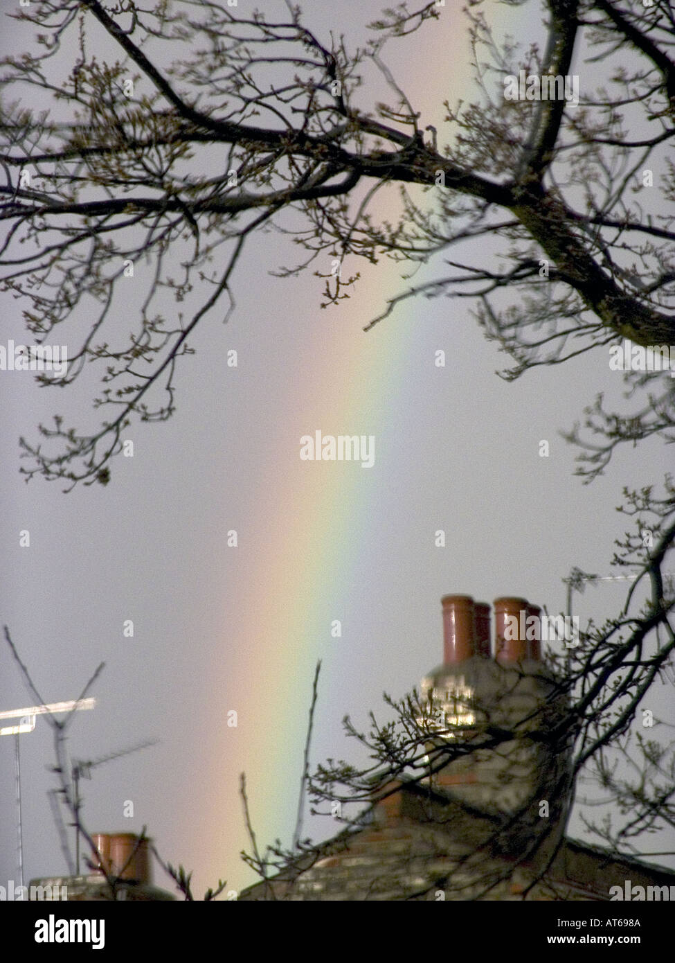 Suburban roof top crowned with a rainbow Stock Photo - Alamy