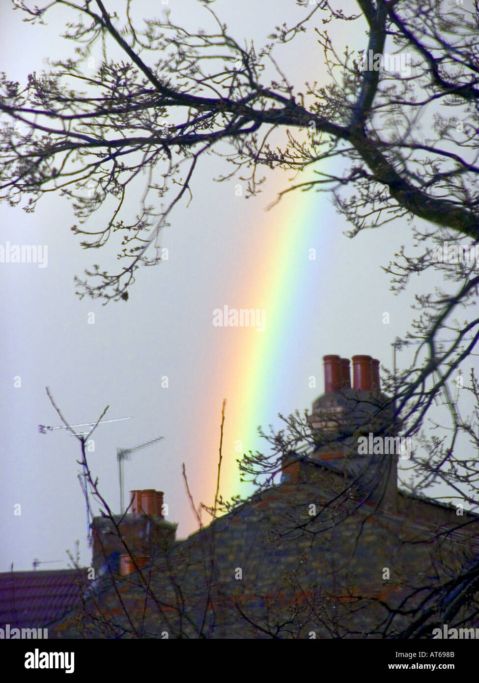 Suburban roof top crowned with a rainbow Stock Photo - Alamy