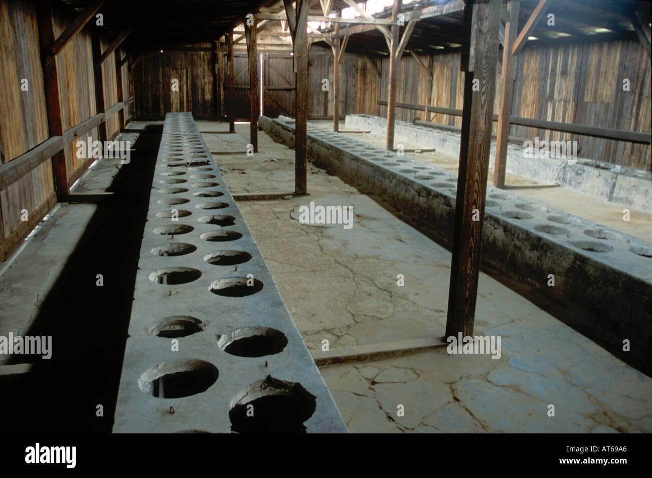 Group toilets at Birkenau near Auschwitz Nazi death camp site of the ...