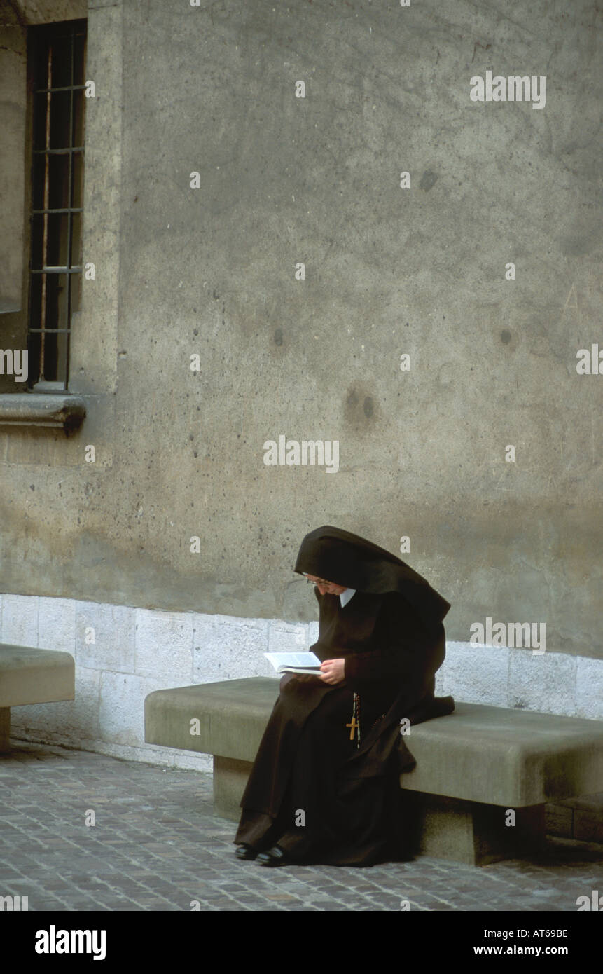 Catholic Sister Nun reading and studying the Bible Holy Scriptures at ...