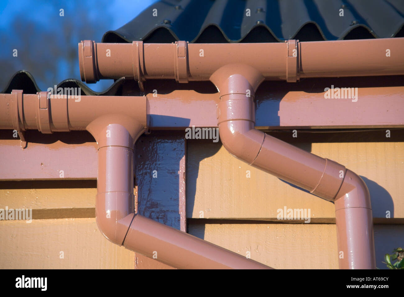 A drainpipe on the roof of a building Stock Photo - Alamy