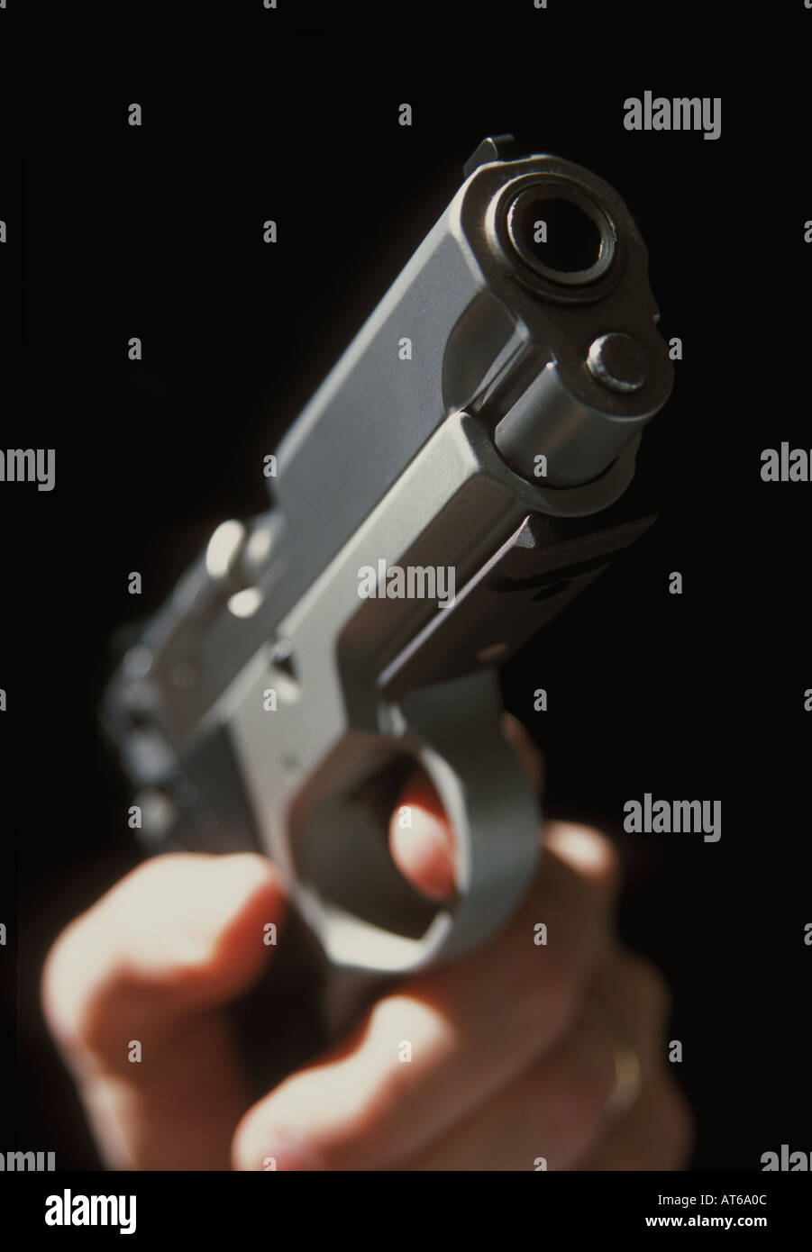 Semi automatic pistol being pointed and ready to fire Stock Photo - Alamy