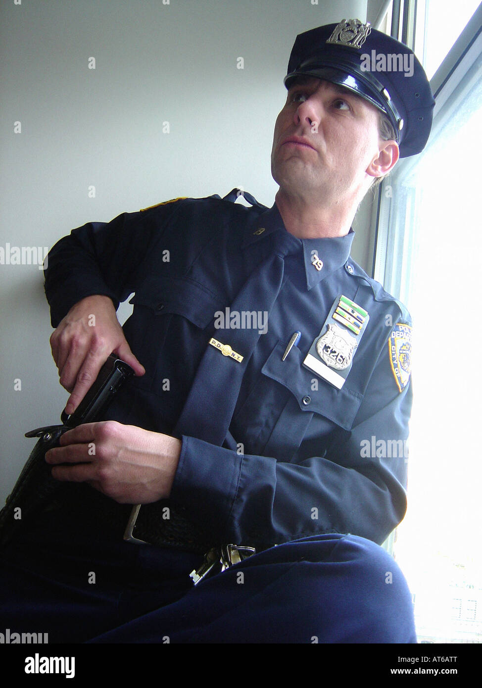 Portrait of a New York City Police Officer Near a Window He is Touching ...