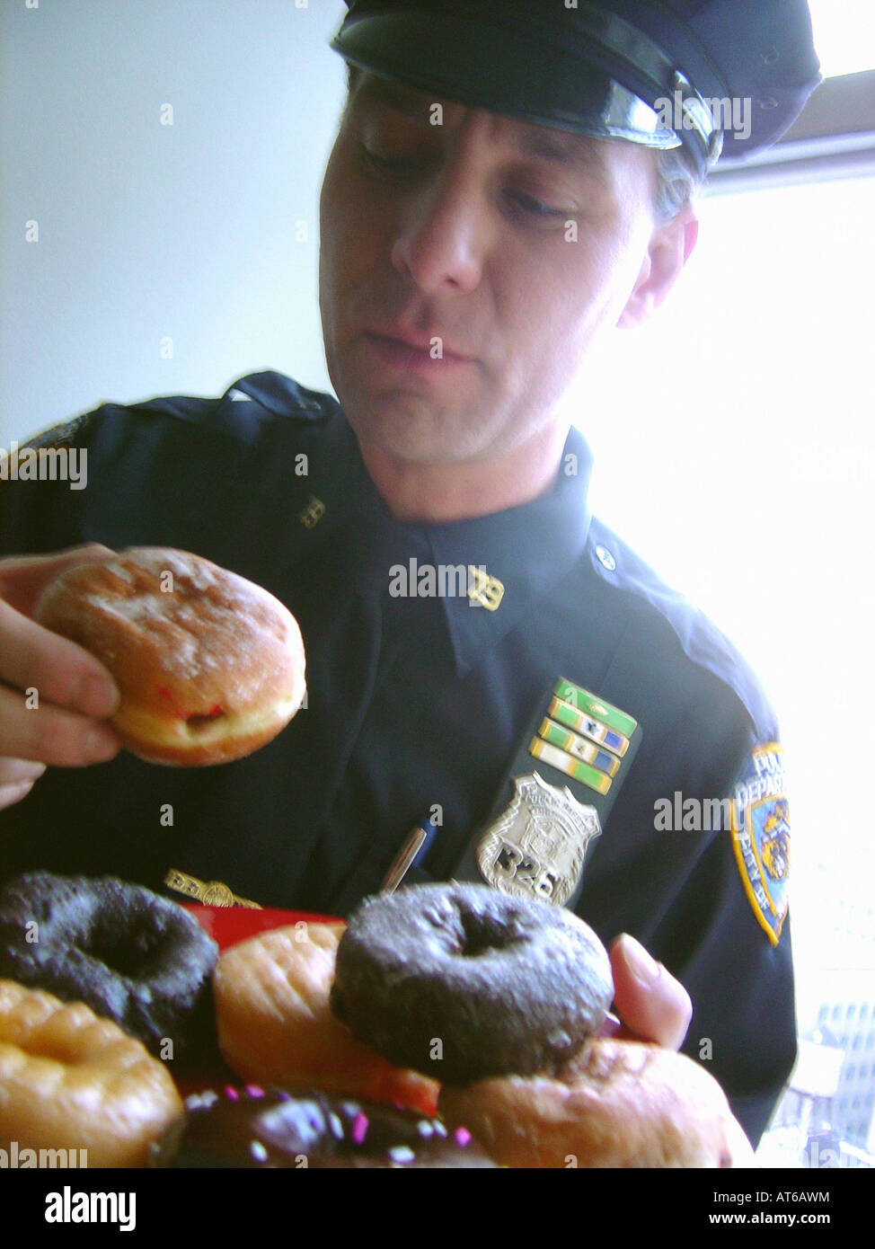 New york police officer and doughnut hi-res stock photography and ...