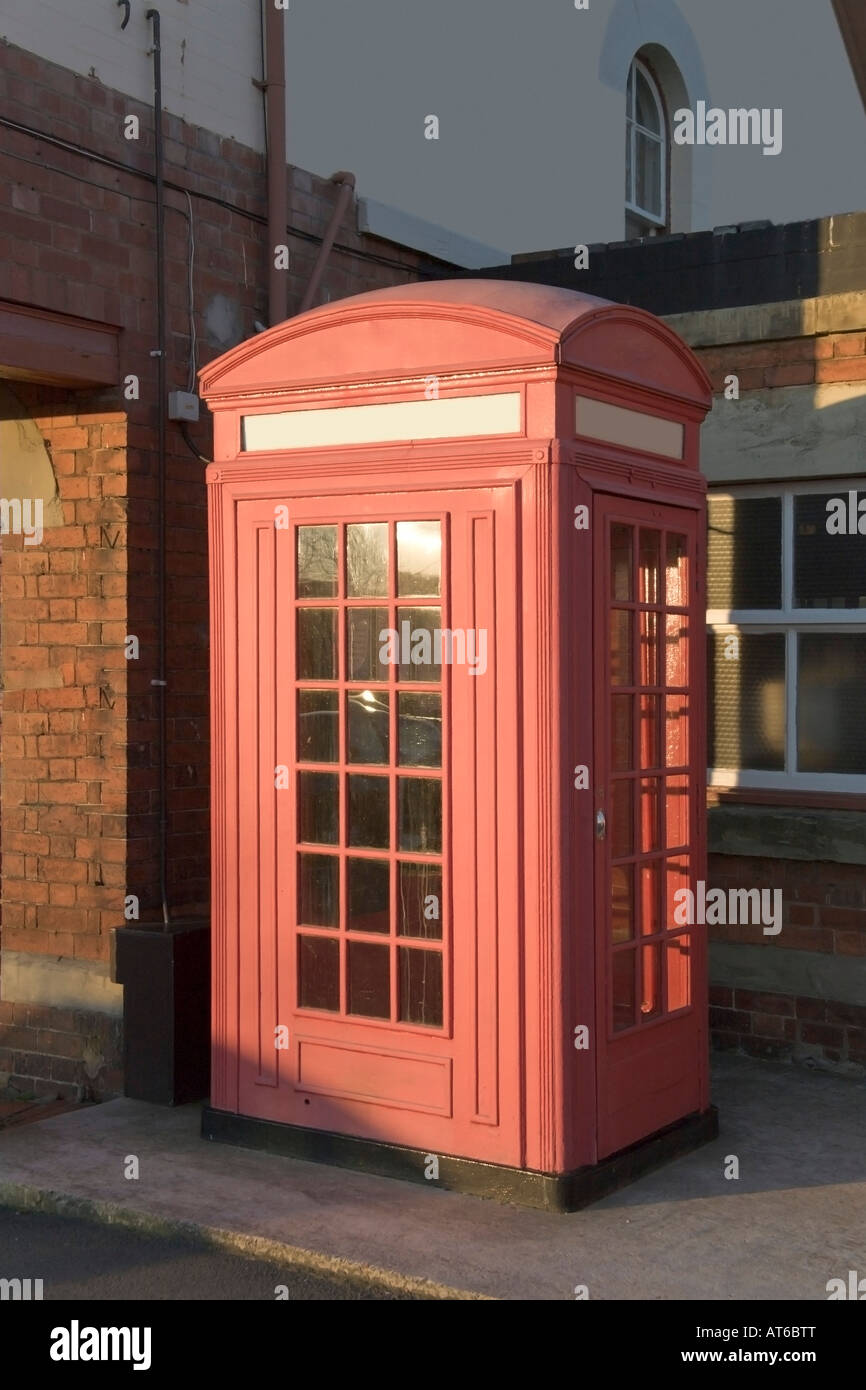 A red telephone box in a station Stock Photo - Alamy