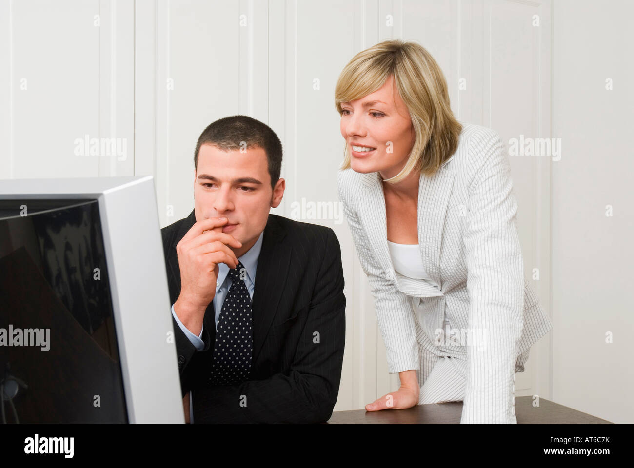 Person looking at 2 computer screens hi-res stock photography and ...