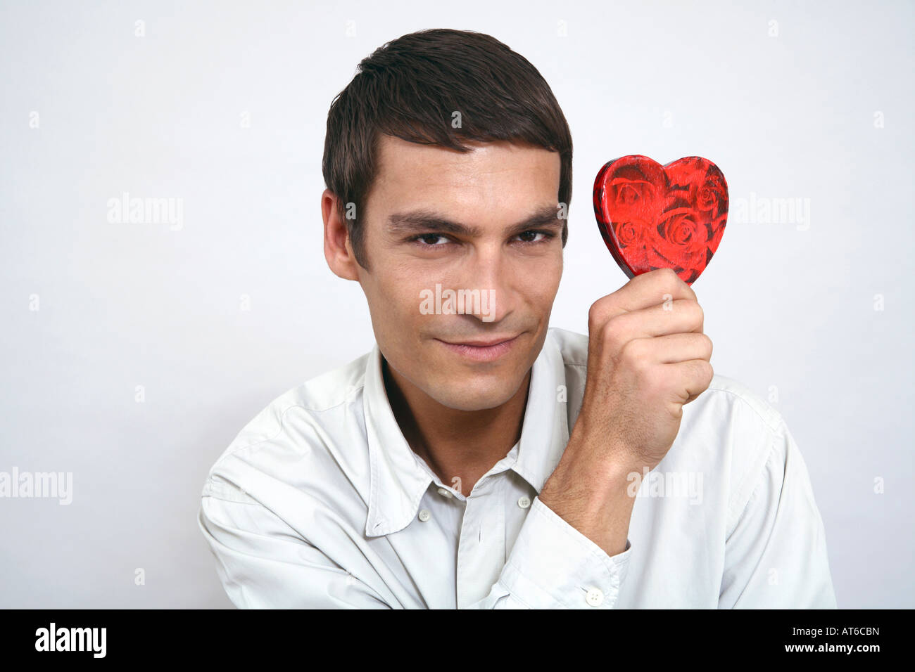 Man holding red heart, close-up Stock Photo - Alamy