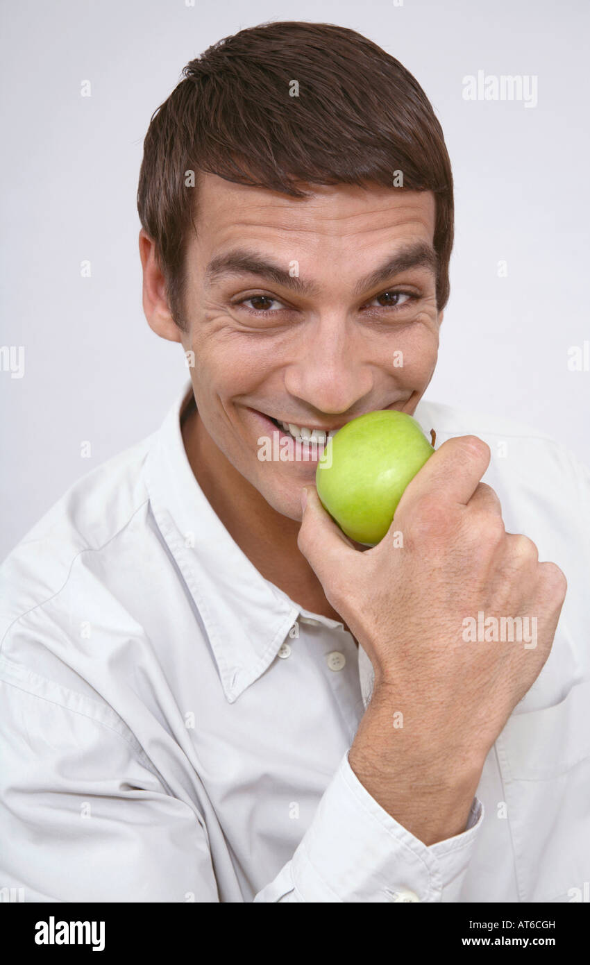 Man holding apple, close-up Stock Photo - Alamy