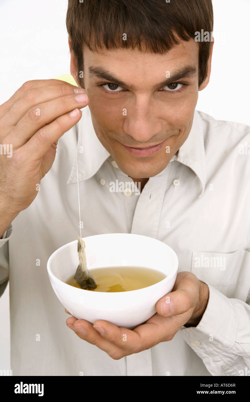 Man holding tea bowl, close-up Stock Photo - Alamy