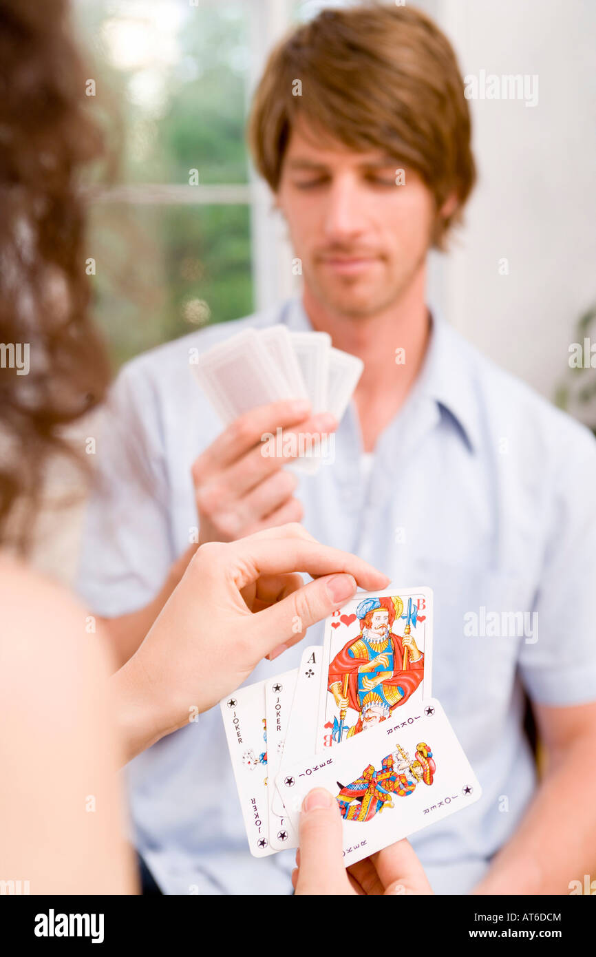 Young couple playing cards Stock Photo - Alamy
