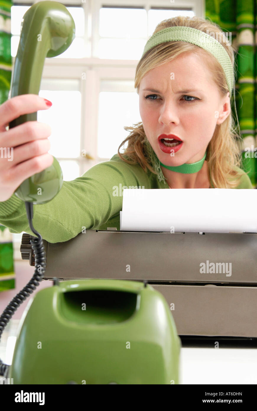 Female hand holding the receiver of an old telephone hi-res stock ...