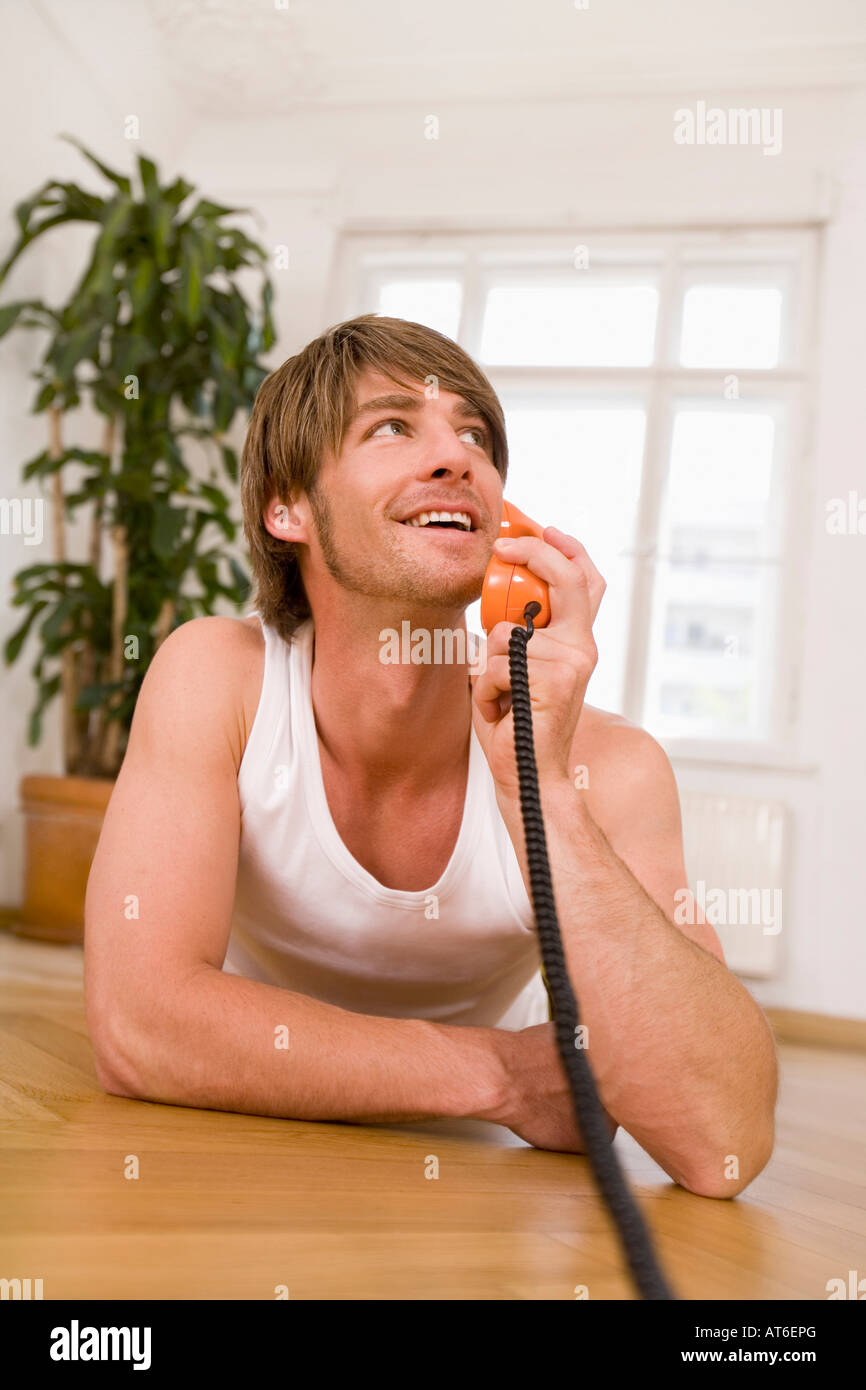Young man talking on phone Stock Photo - Alamy