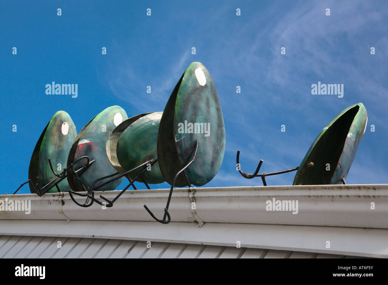 Metal mussel sculptures adorn the roof of "The Mussel Pot" restaurant ...