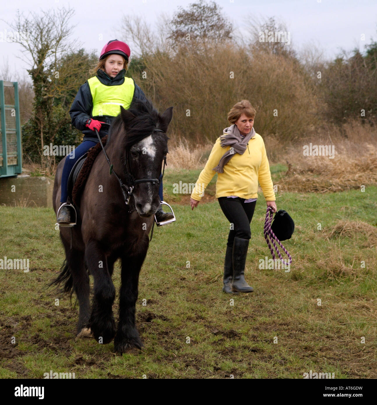 Pony Rider and Instructor in English Countryside Stock Photo - Alamy