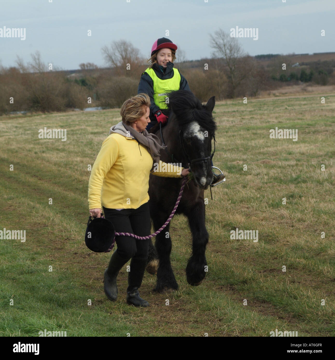Pony Rider and Instructor in English Countryside Stock Photo - Alamy