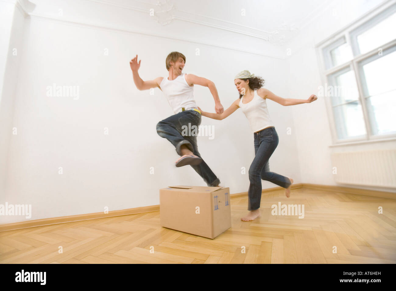 Young woman following man, inside Stock Photo - Alamy