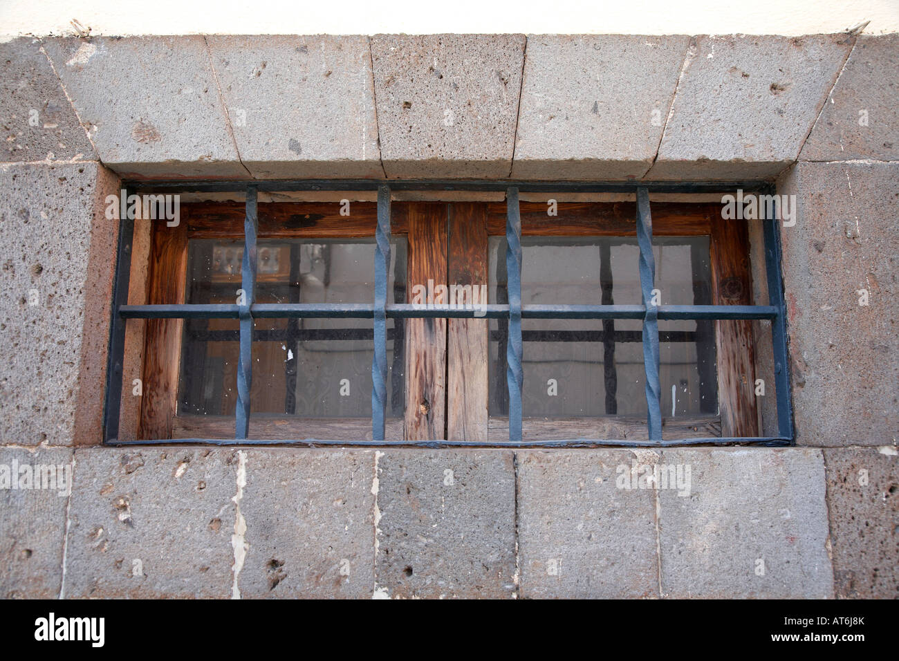wrought iron metal grill over traditional wooden windows in church in ...
