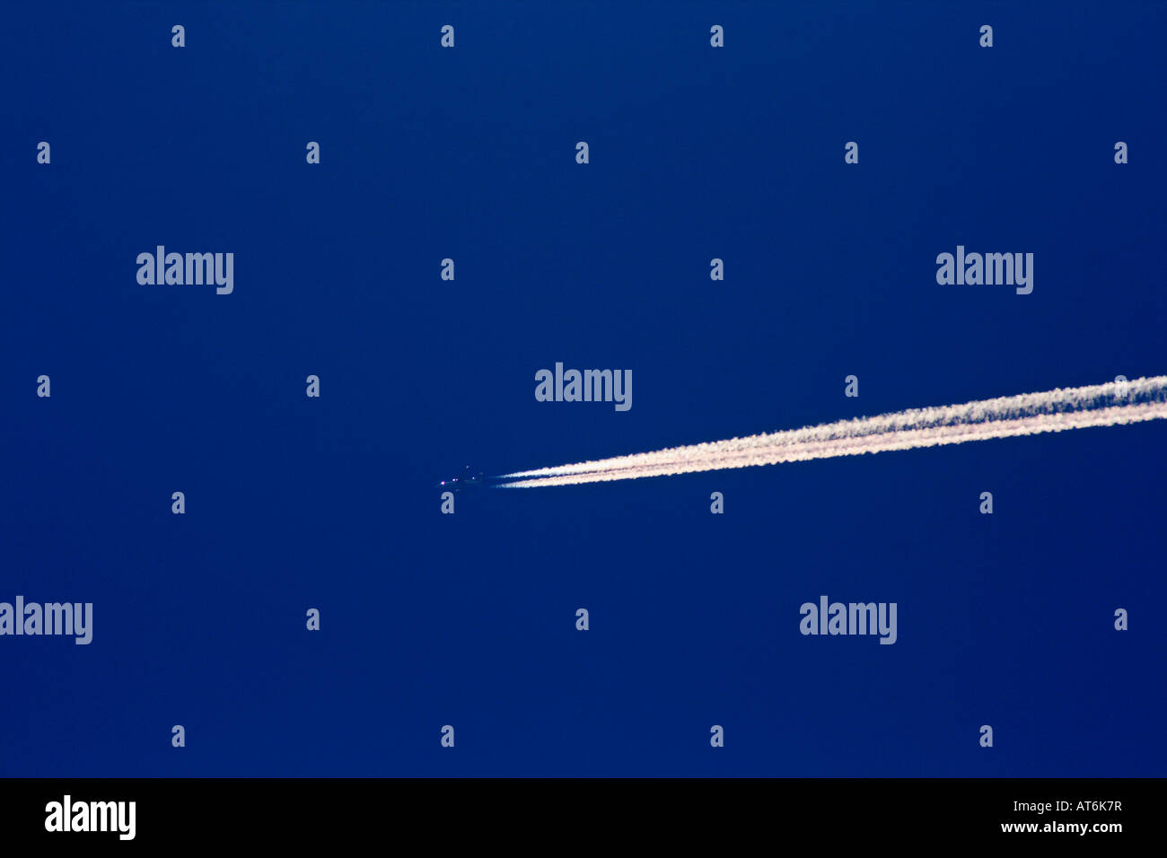 Airplane and Contrail Stock Photo - Alamy